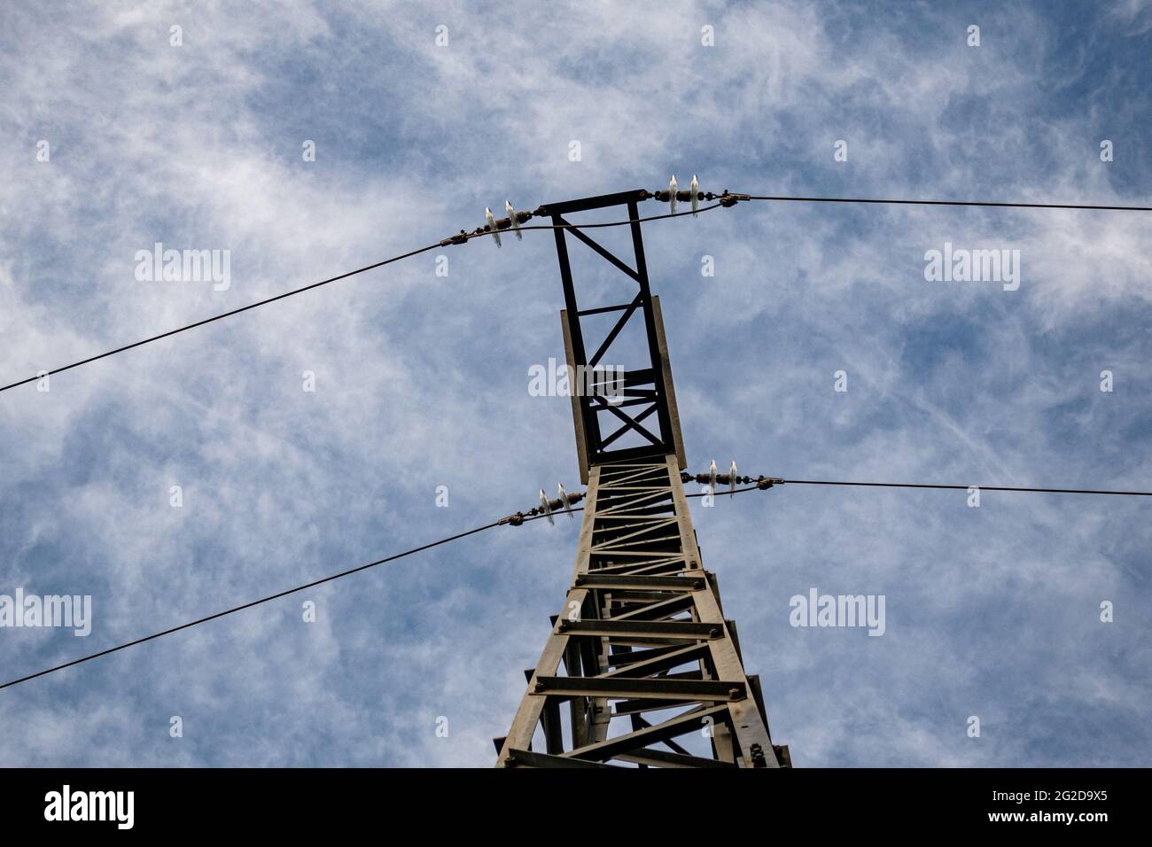 Low angle shot of overhead high-voltage power lines Stock Photo - Alamy