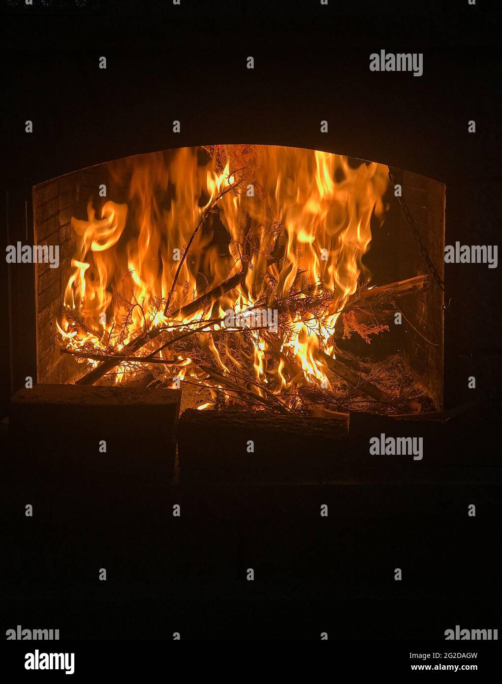 setting up fire in the fireplace, burning branch in winter in cold ...