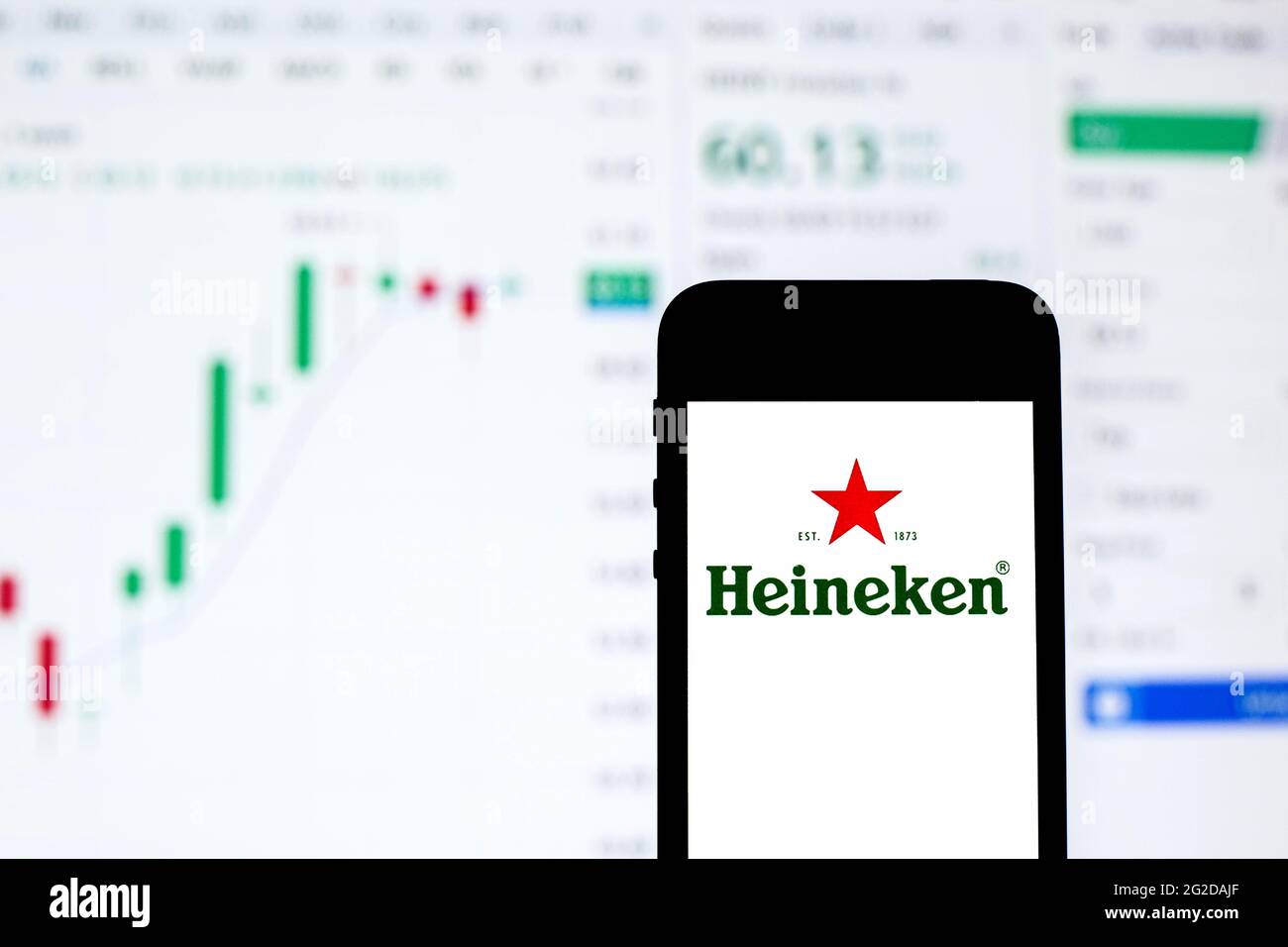 In this photo illustration a Heineken logo seen displayed on a ...