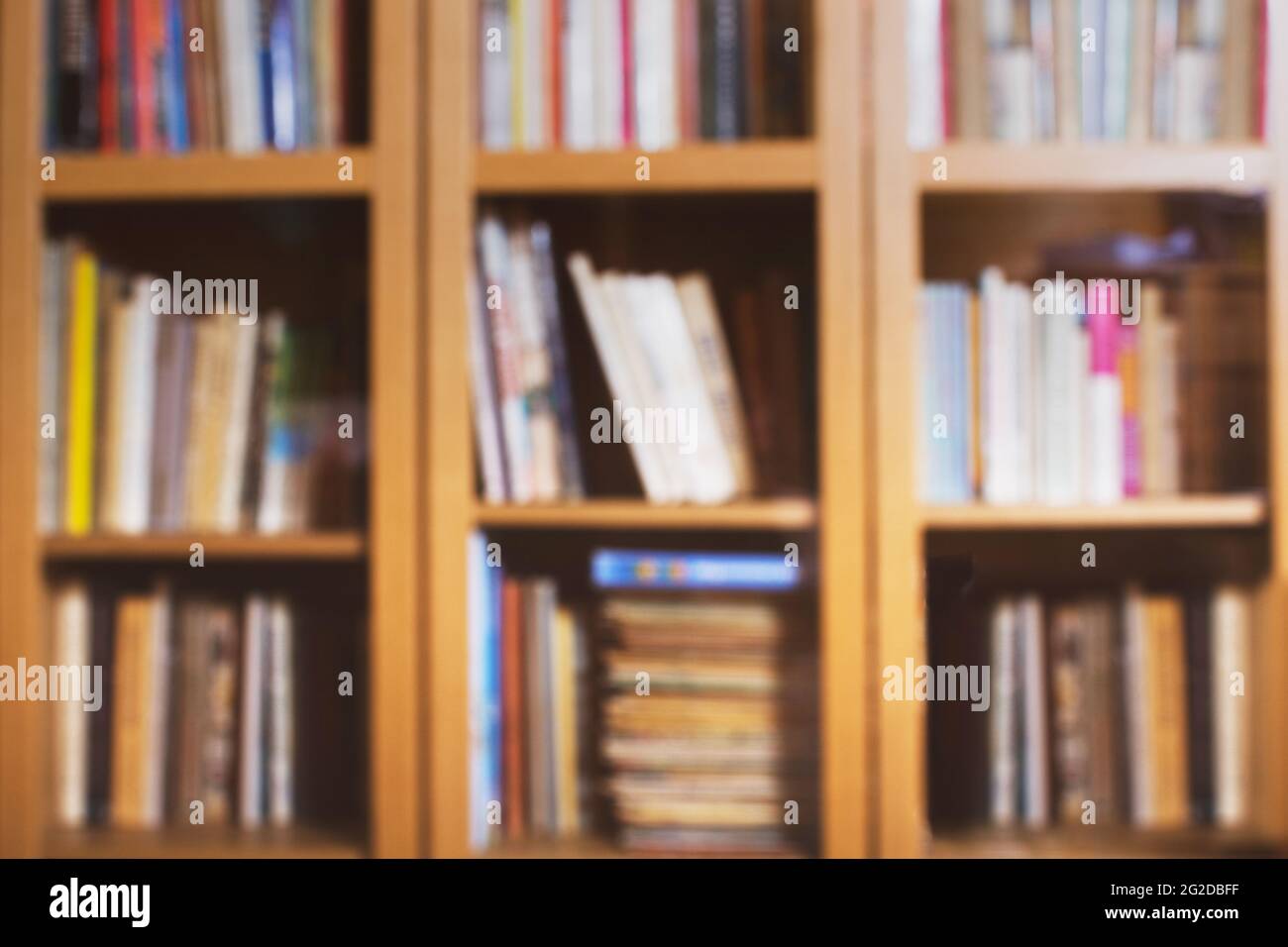 Blured home library background with colorful books Stock Photo - Alamy