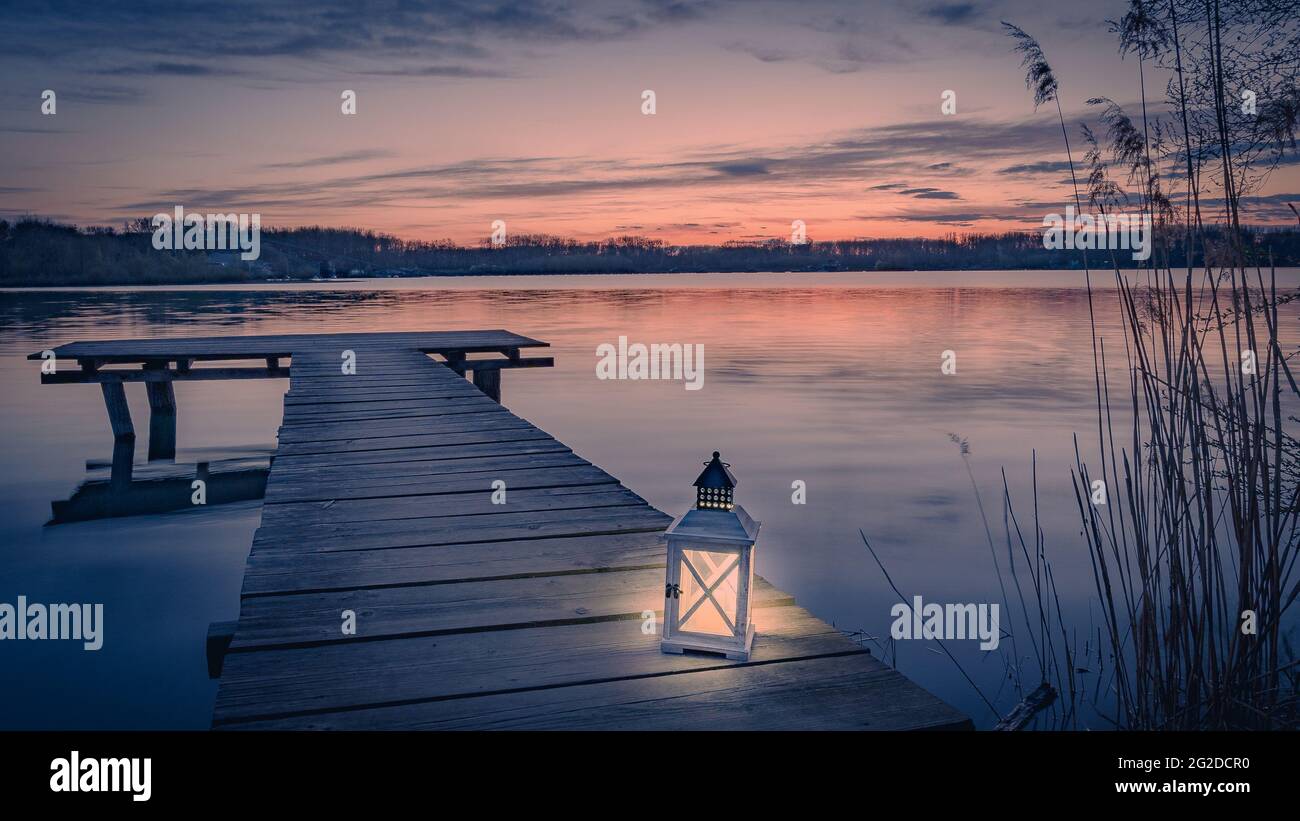 lamp on the jetty Stock Photo - Alamy