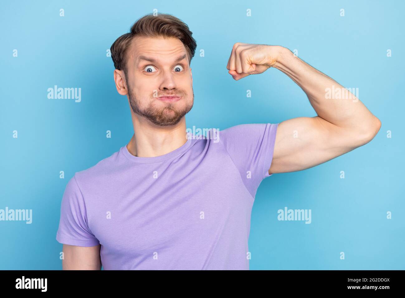 Portrait of excited positive person hold breath cheeks arm flex show ...