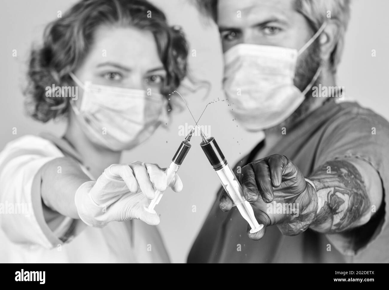 use both. say no to coronavirus. virus remedy injection. doctors wear ...