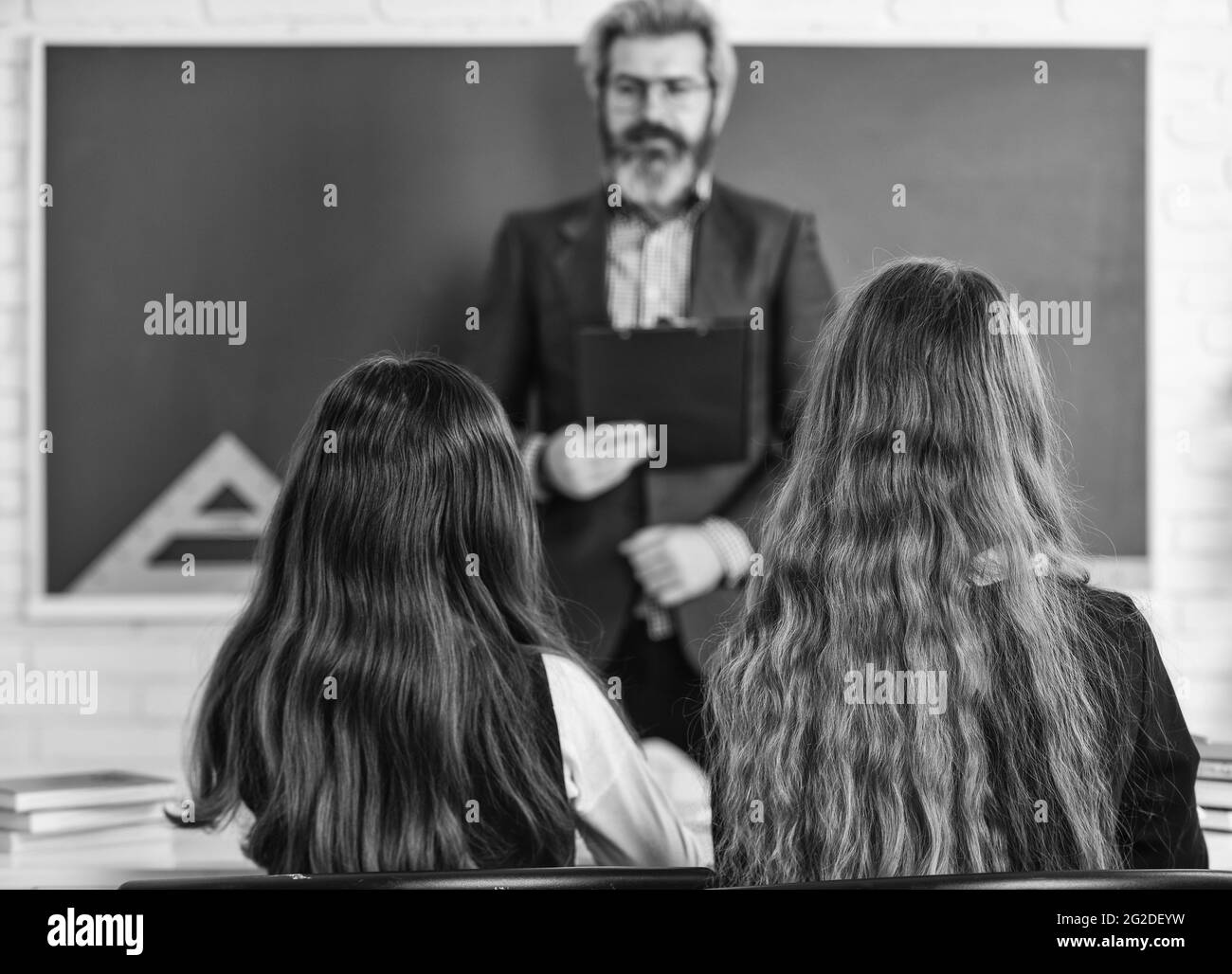 Elementary Pupil With Teacher In Classroom. Discussion group of ...
