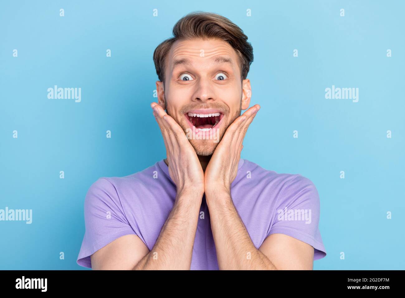 Photo of impressed cheerful person arms on cheeks open mouth cant ...