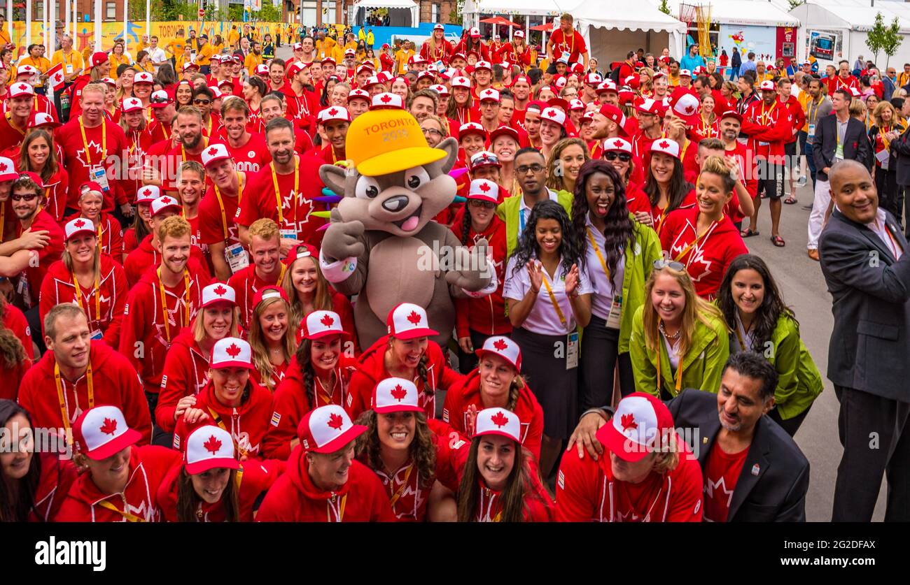 Canadian athletes and officials posing for photograph with mascot Pachi ...
