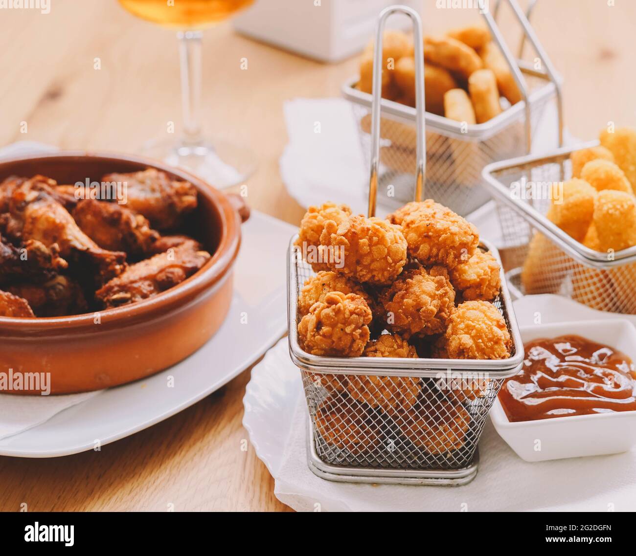 A serving of chicken wings in a tapas bar Stock Photo - Alamy