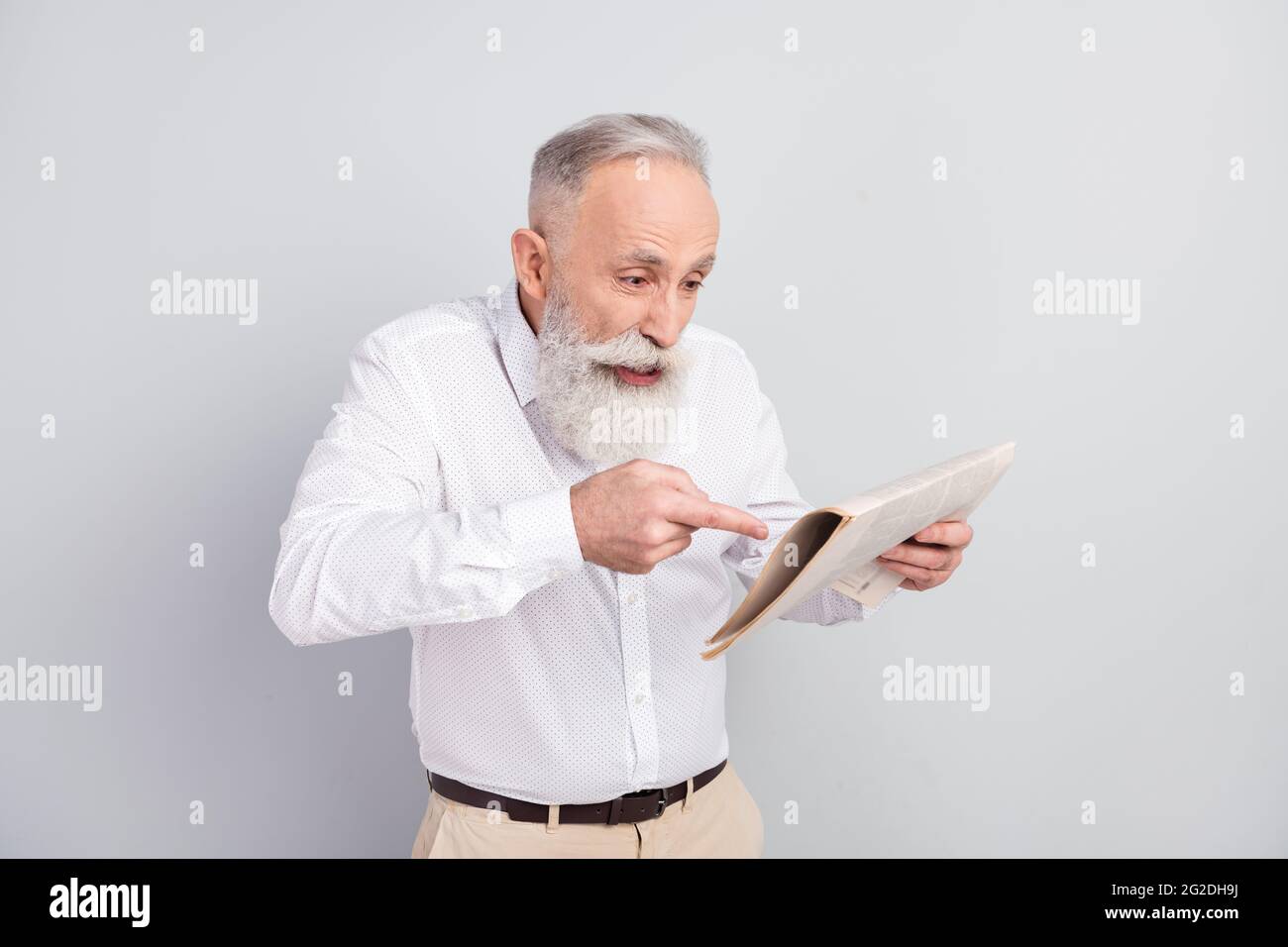 Photo of aged man angry mad point finger newspaper fake novelty news ...