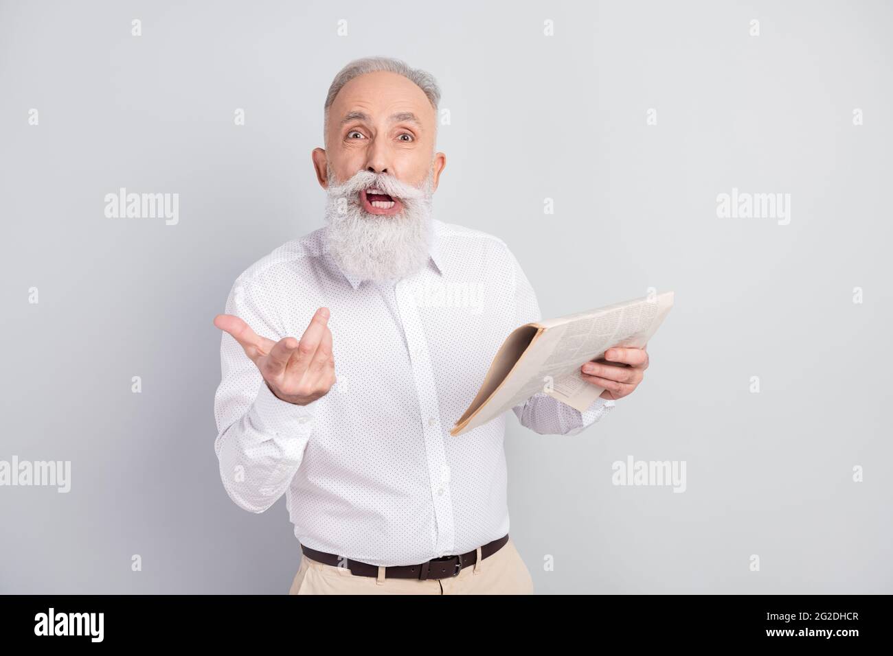 Photo of angry old man hold newspaper scream unhappy bad mood irritated ...