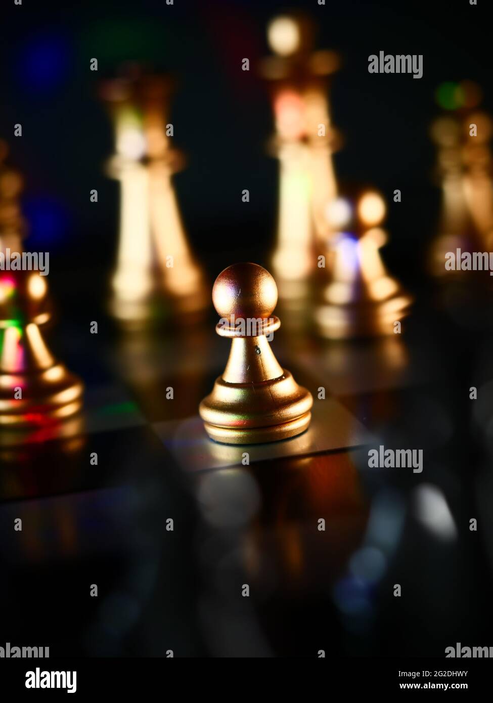 Selective focus shot of a golden pawn chess piece on a chessboard Stock ...