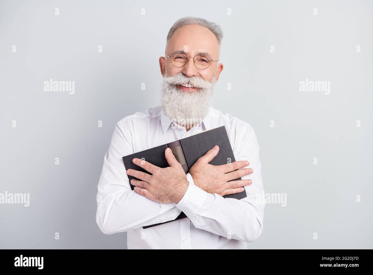Photo of charming attractive happy man embrace book smile good mood ...