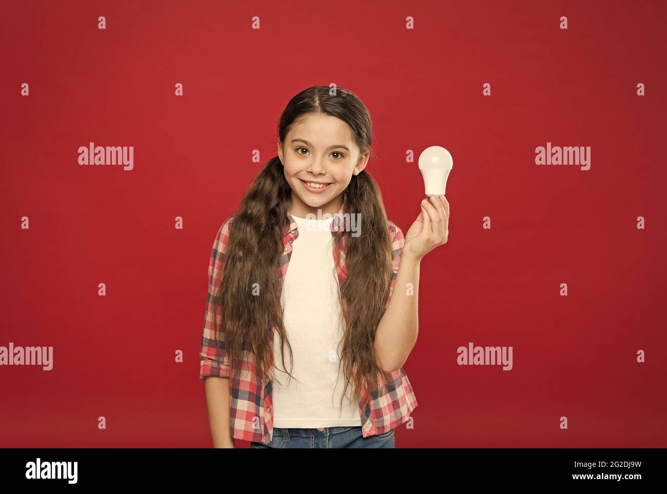 teen kid showing lamp bulb. girl lighting lamp. inspired child ...