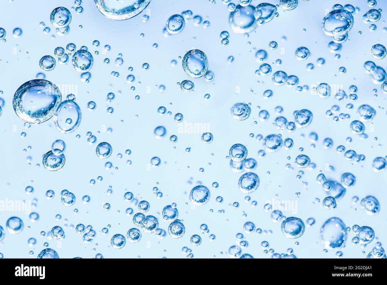 Close up macro Aloe vera gel cosmetic texture blue background with ...