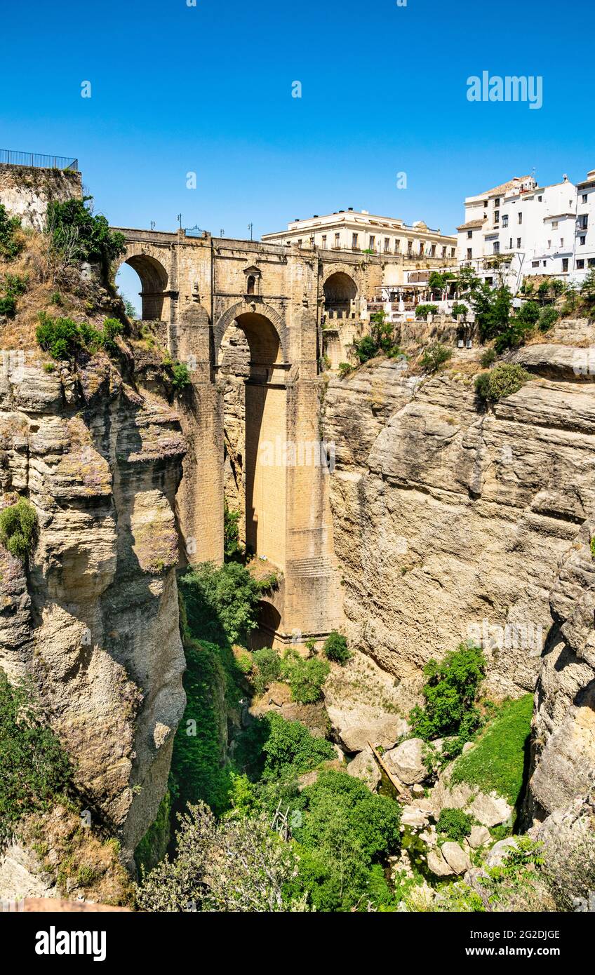 a view of the famous bridge crossing in the Spanish town of Ronda in ...