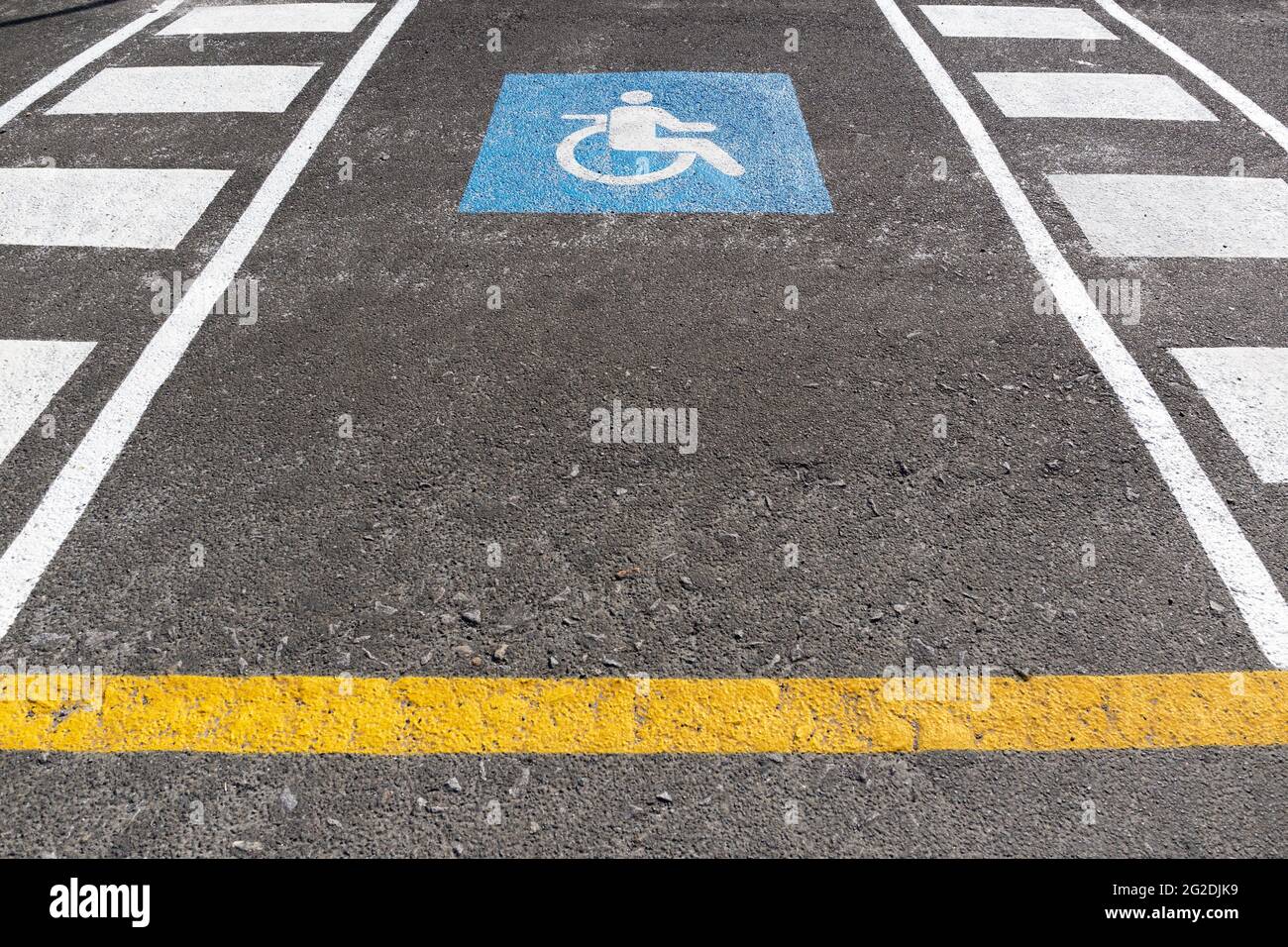 Wheelchair parking space on outdoors. Traffic sign handicapped symbol ...