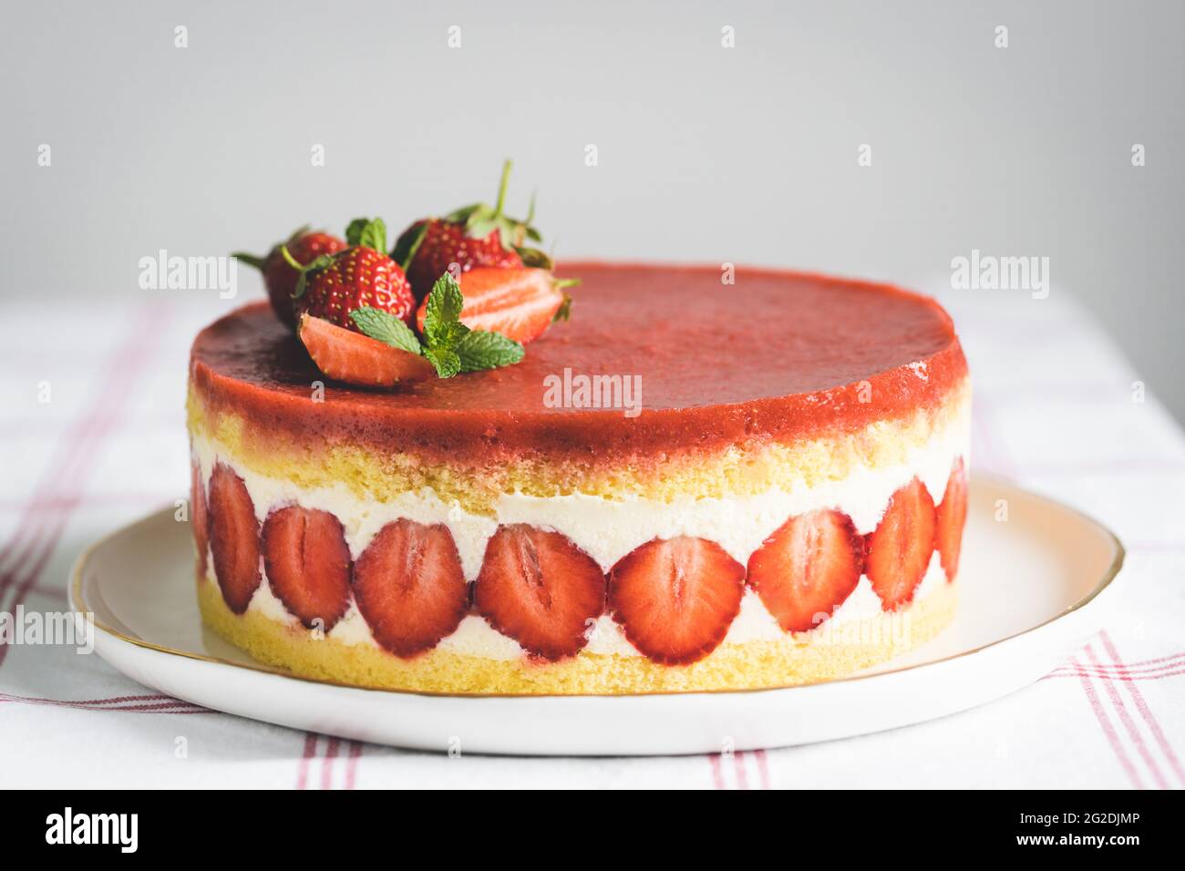 French strawberry cake Fraisier on white plate Stock Photo - Alamy