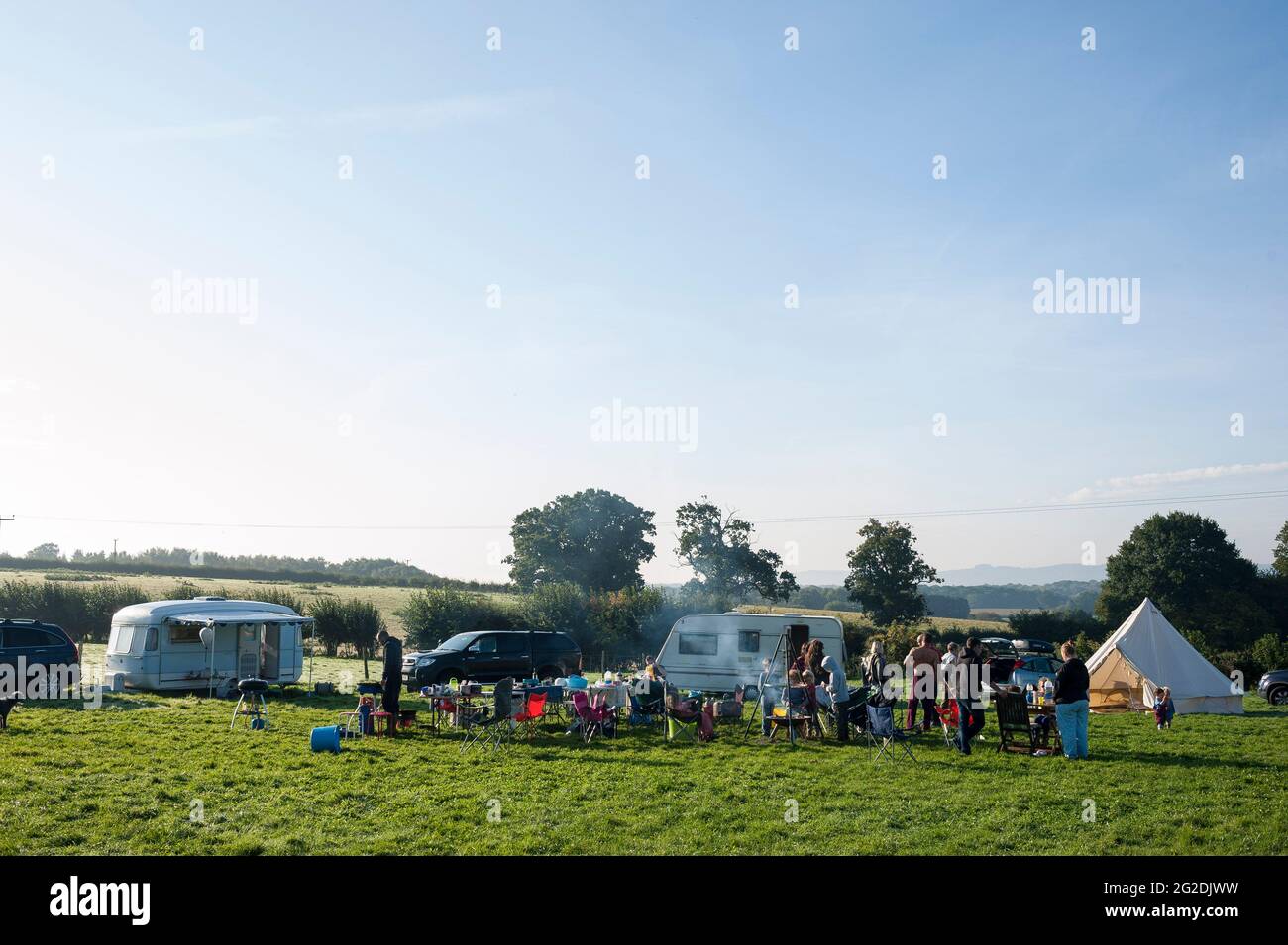 Family and friends enjoying a caravan and camping staycation trip Stock ...