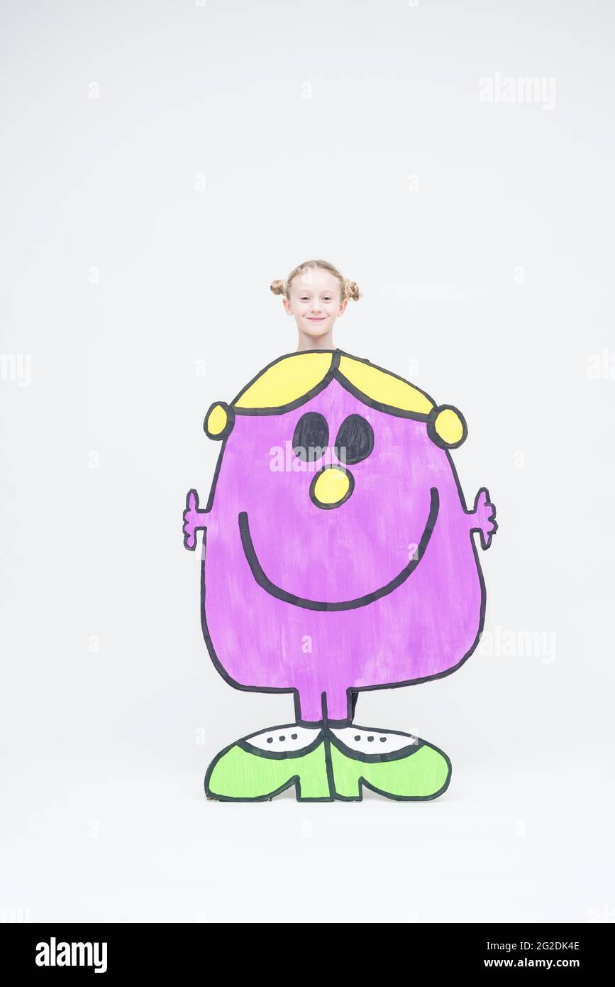 A person standing with a cardboard cut out of a little miss / mr men ...