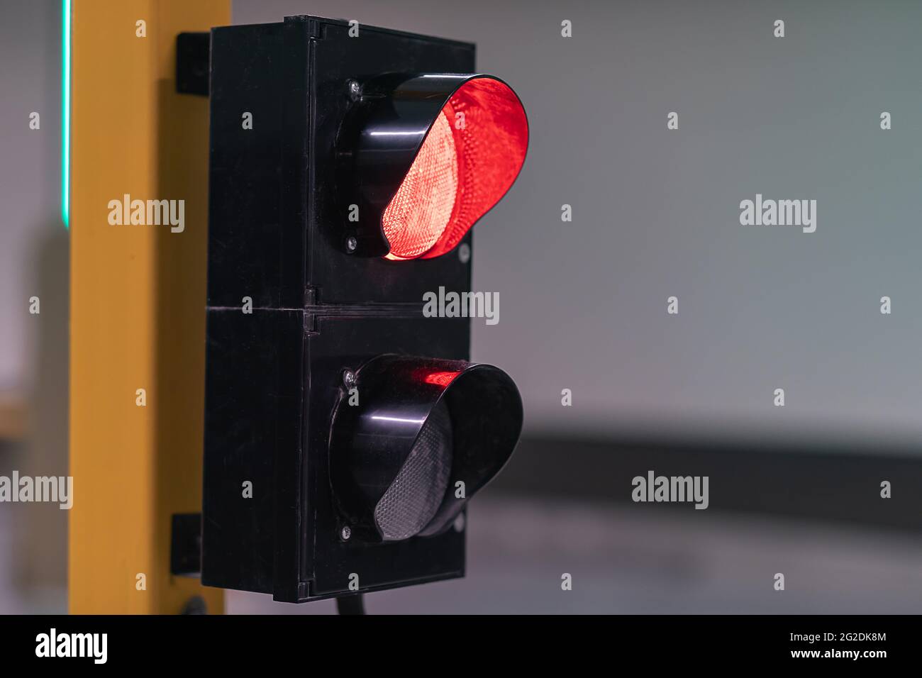 Traffic lights closeup turn red when entering or exiting parking lot ...