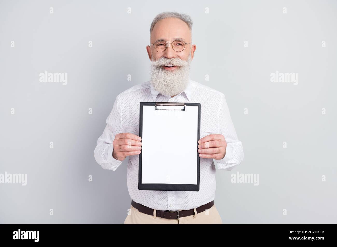 Photo of aged man happy positive smile show clipboard paper documents ...
