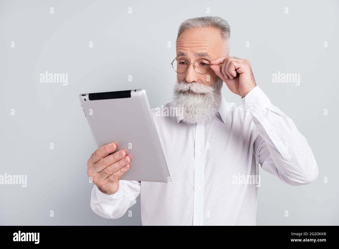 Photo of minded thoughtful smart old man look empty space wear glasses ...