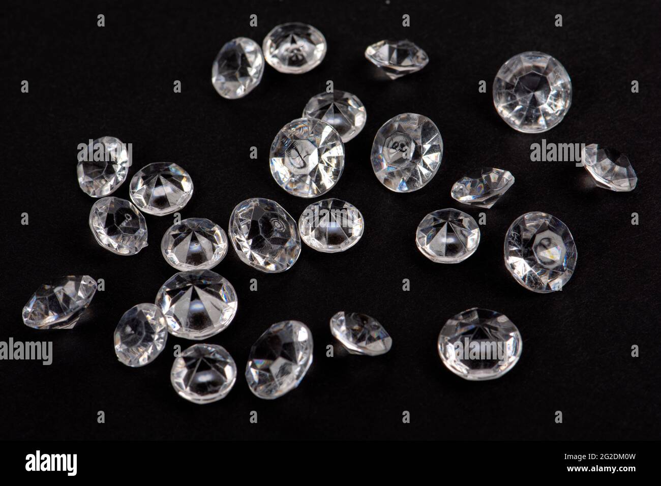 Close up diamonds on black background Stock Photo - Alamy