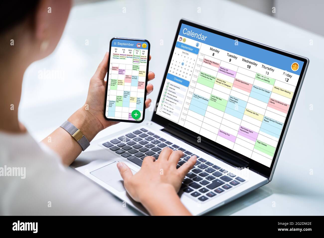 Executive Looking At Calendar On Computer. Arranging Weekly Schedule ...