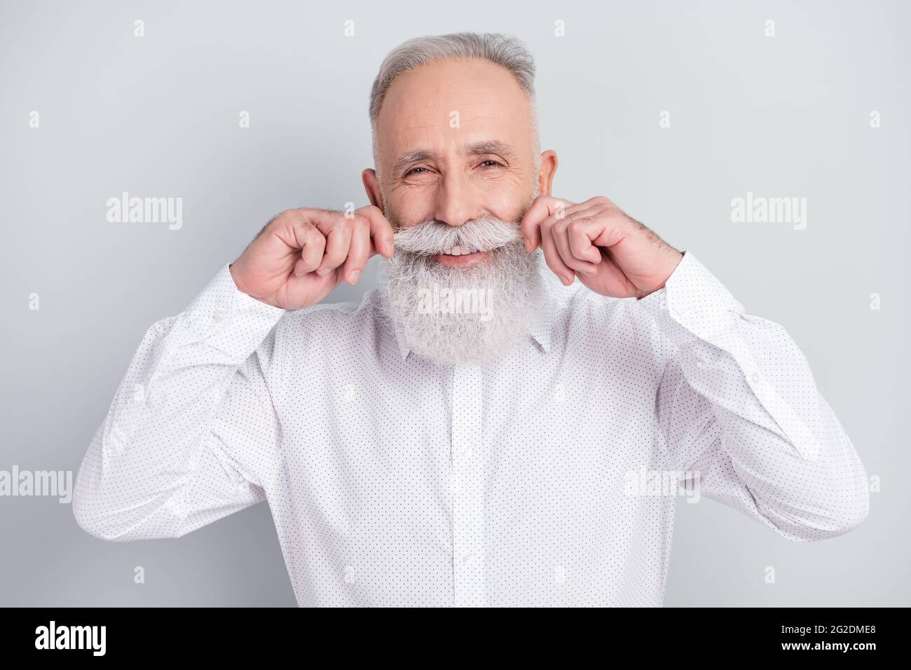 Photo of elegant charming positive old man hold fix mustache smile good ...