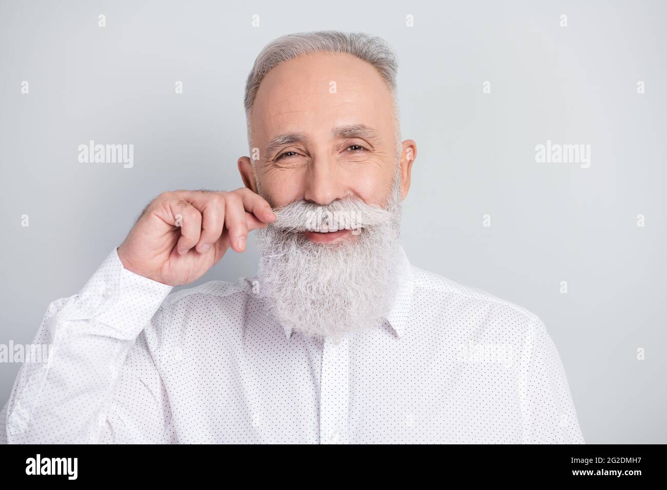 Photo of charming cheerful old man fix mustache smile good mood happy ...