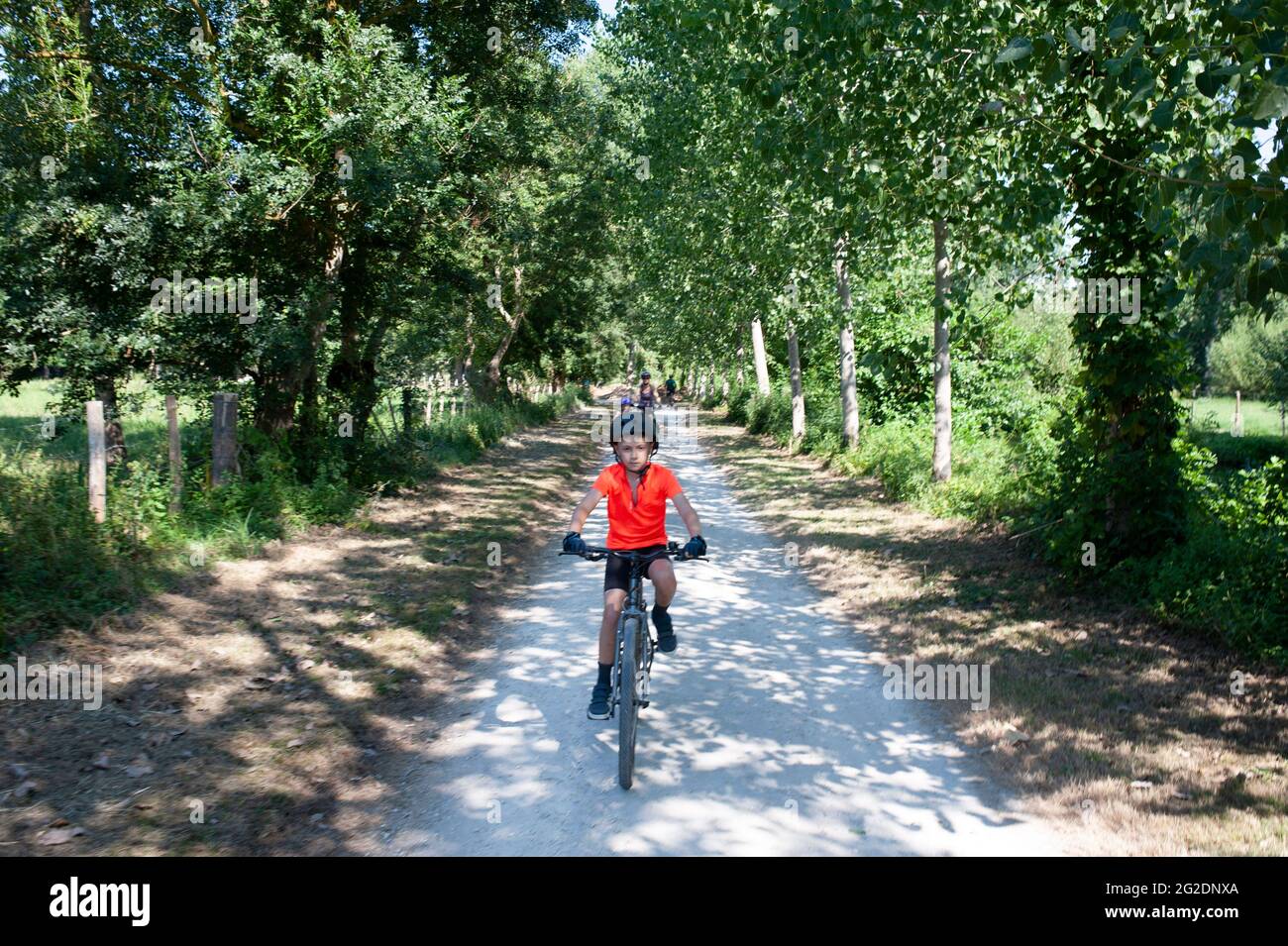 A family cycle through nature in rural france and explore the landscape ...