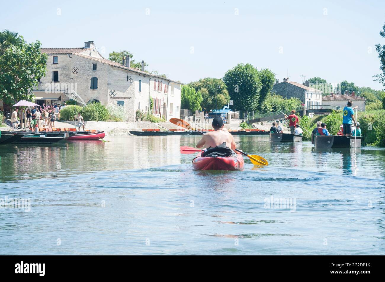 A family kayaks in Regional Natural Park of the Marais Poitevin on ...