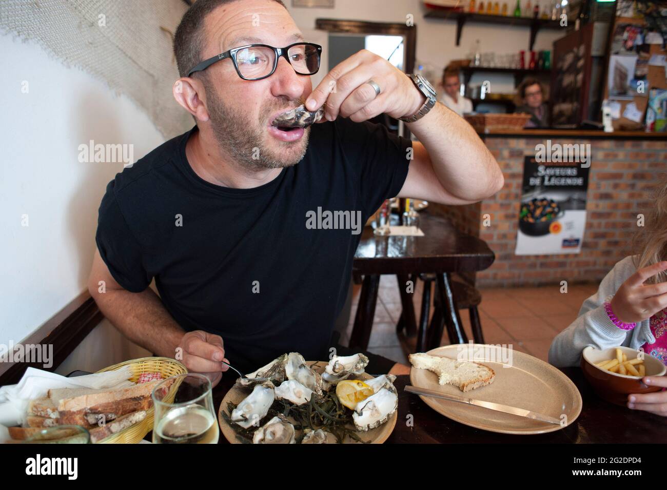 Man eating fish at restaurant hi-res stock photography and images - Alamy