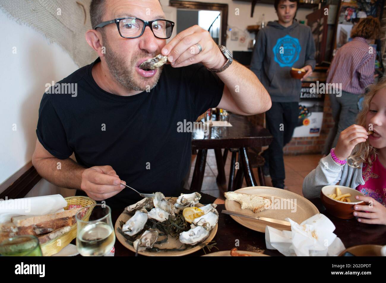 Man eating fish at restaurant hi-res stock photography and images - Alamy