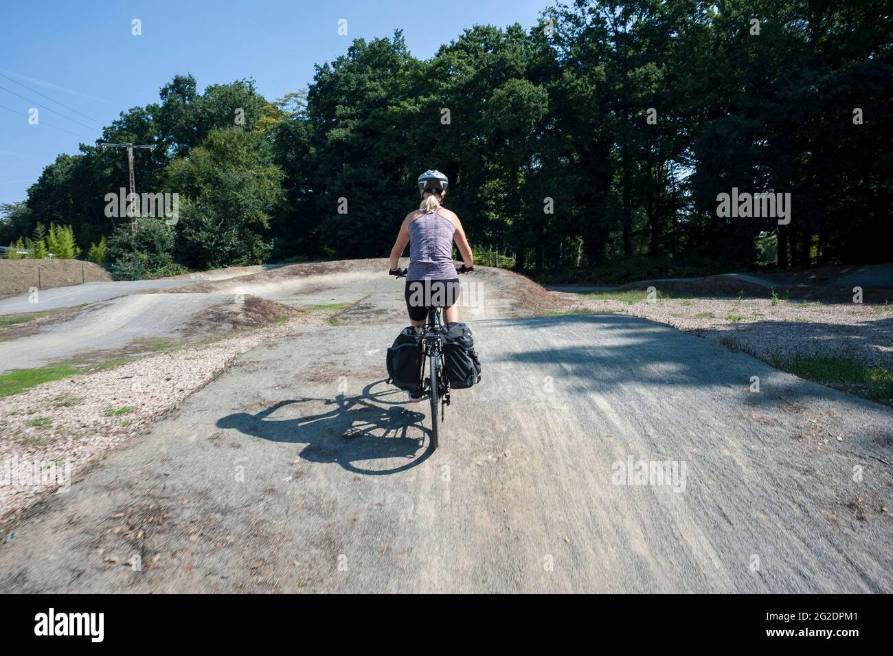 A family riding bikes in France in the summer on cycle paths exploring ...