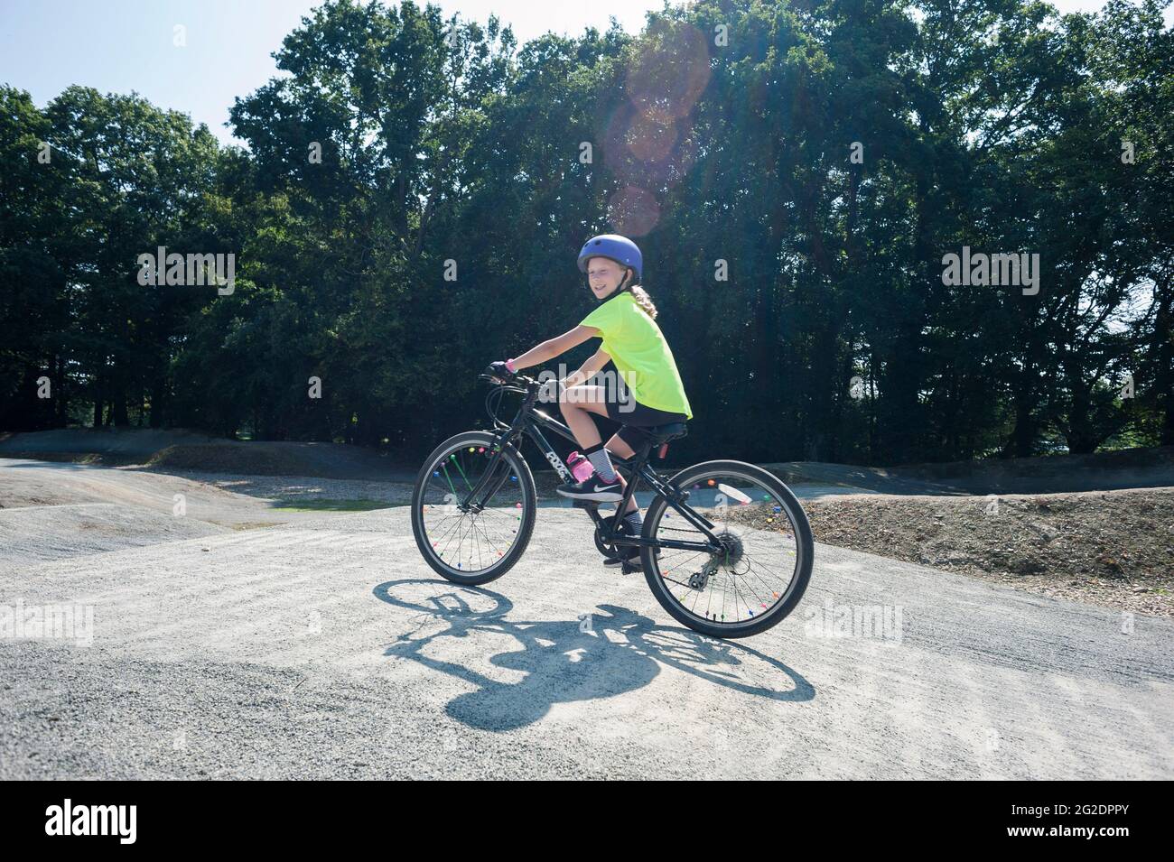 A family riding bikes in France in the summer on cycle paths exploring ...