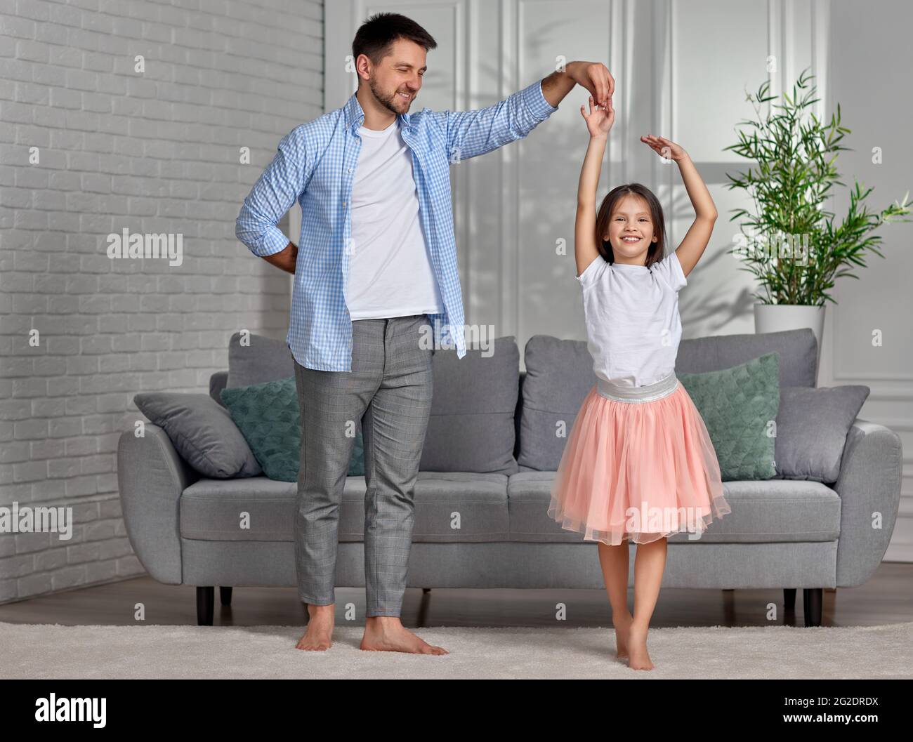 father dancing with his little cute daughter at home Stock Photo - Alamy