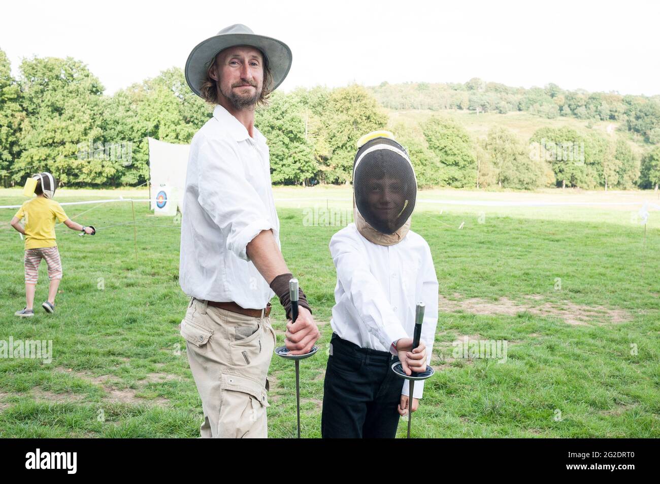 A boy tries sword fighting / fencing sport Stock Photo - Alamy
