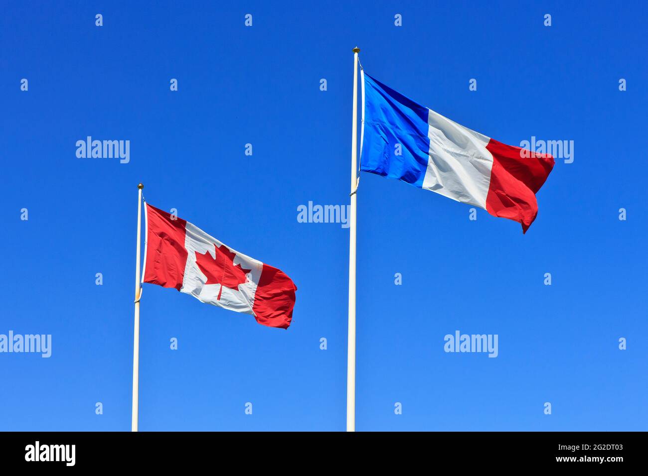 The Canadian and French flags flying proudly side by side at the ...