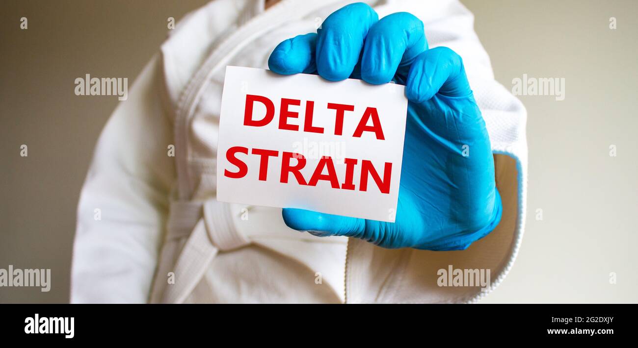 COVID-19 delta indian strain symbol. A young strong man in a white ...