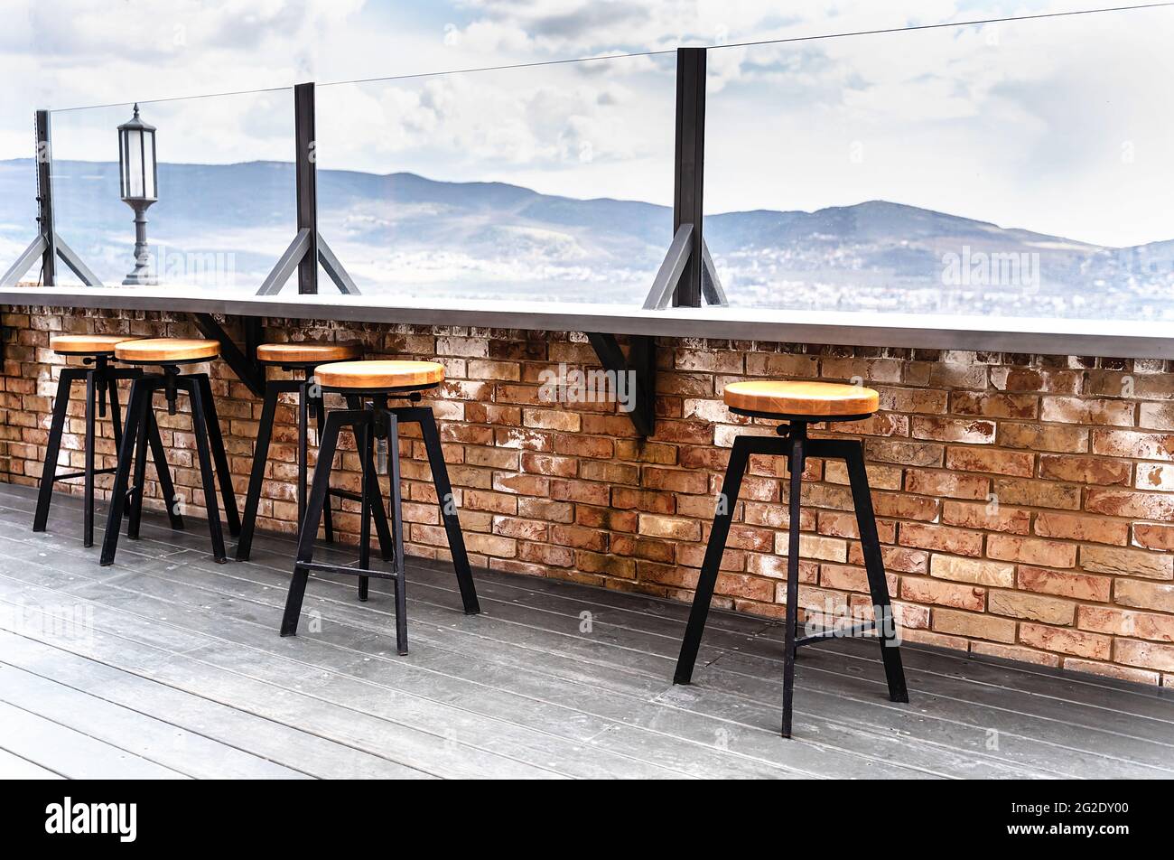 Italian street cafe background in vintage style with mountains in the ...