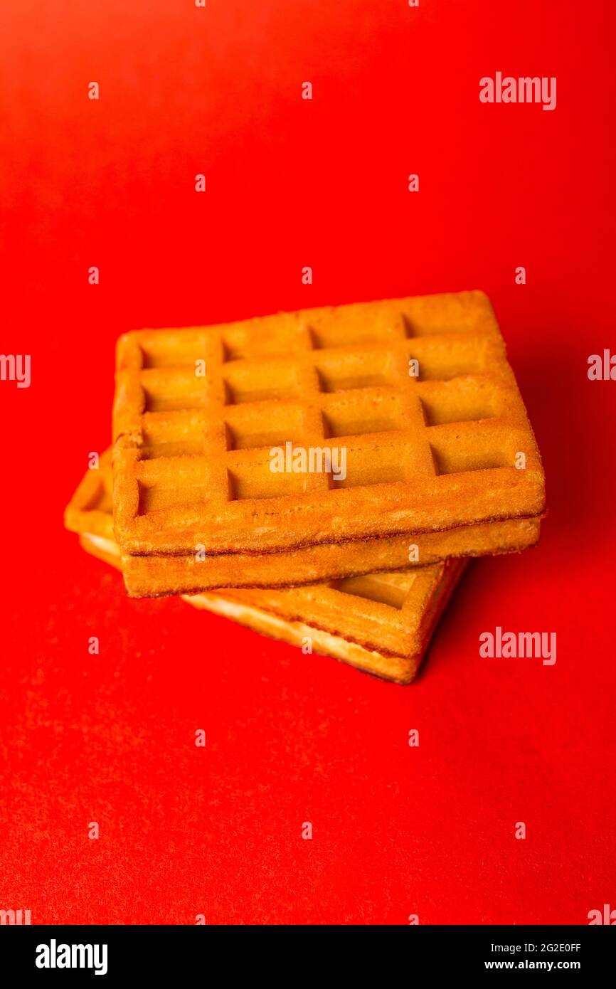 Hungarian waffles close-up on a red background Stock Photo - Alamy