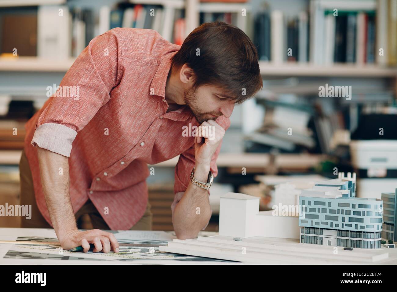 Architect with blueprints and layout design project template on table ...