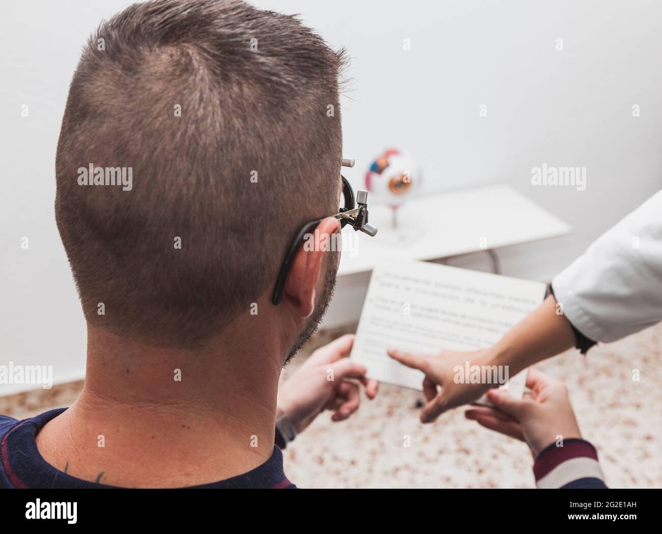 Reading during eyesight examination hi-res stock photography and images ...