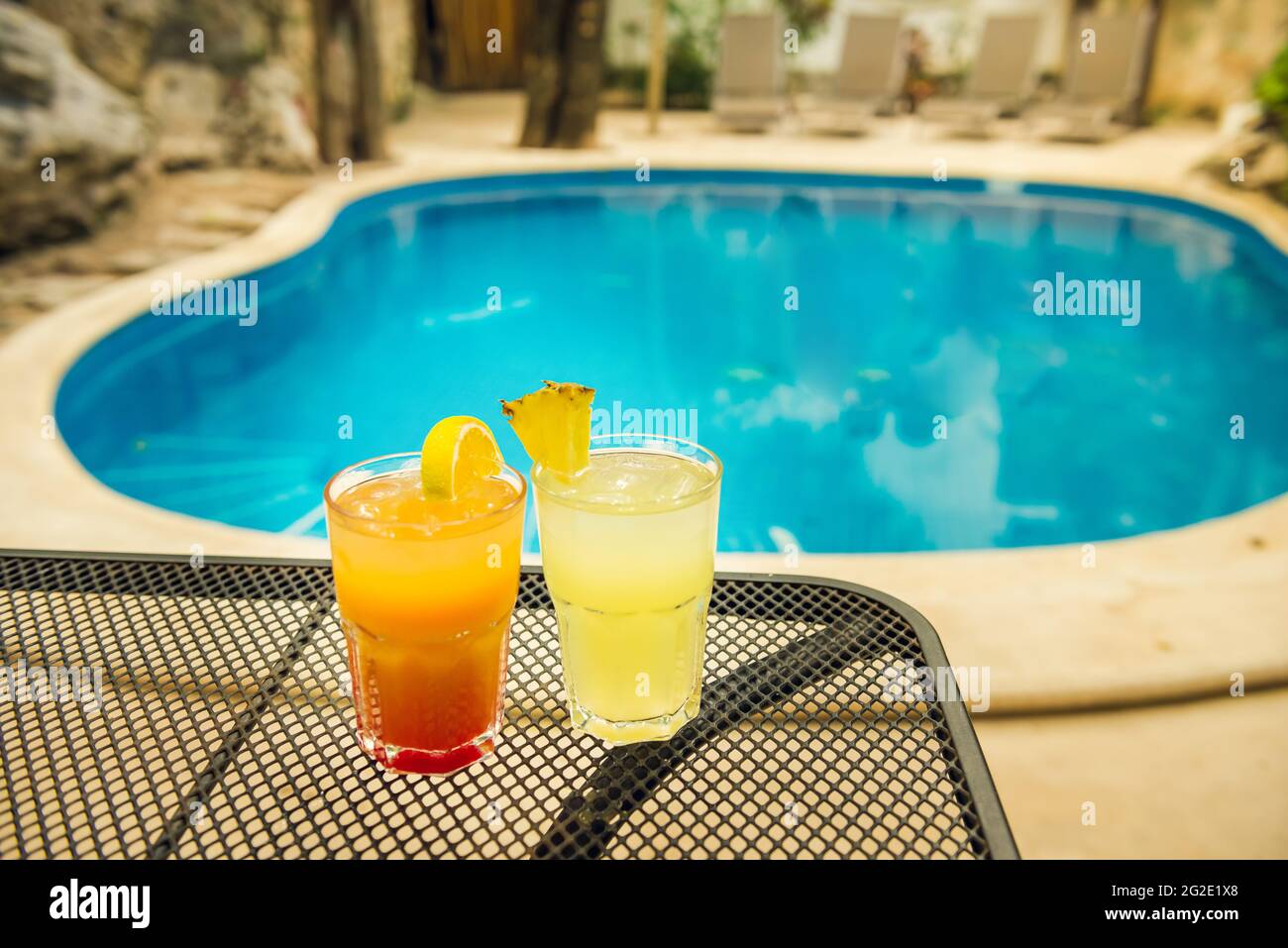 Refreshing alcohol cocktail drinks near the pool Stock Photo - Alamy