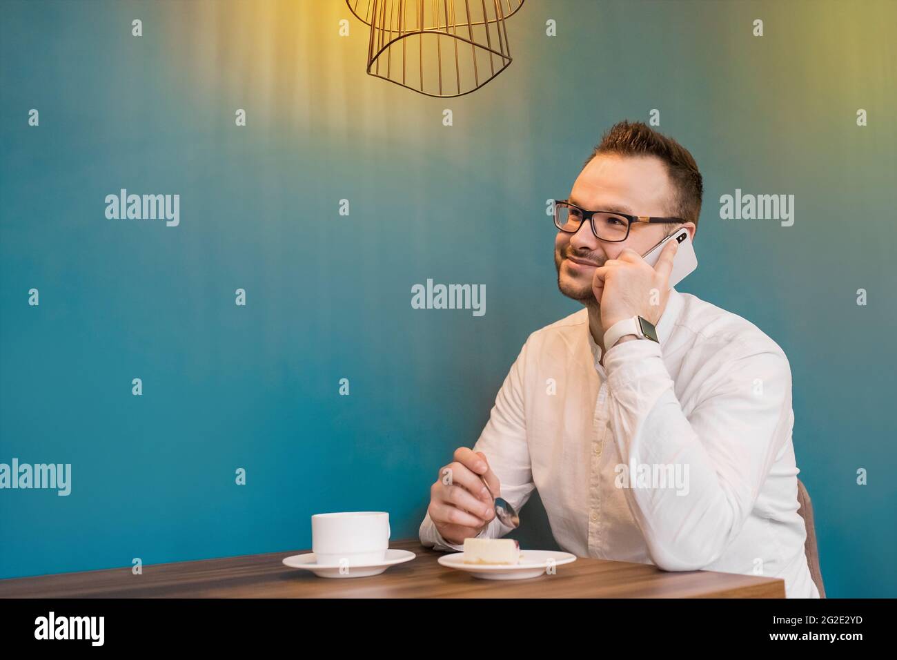 Adult european man businessman with glasses and white shirt talking on ...