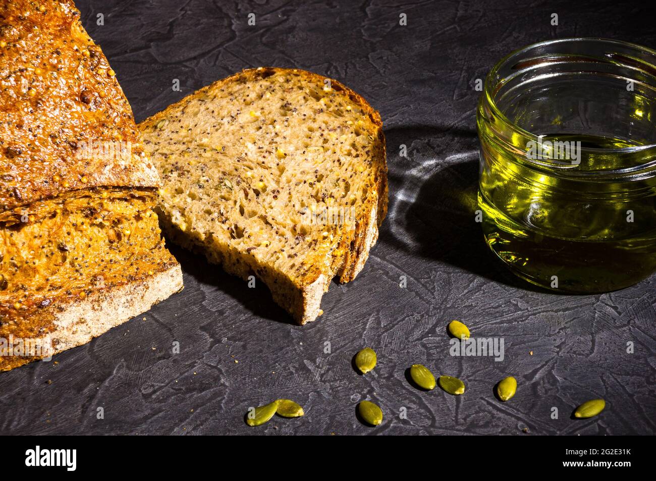 slice of rustic natural yeast-free bread with flax, poppy seeds, sesame ...
