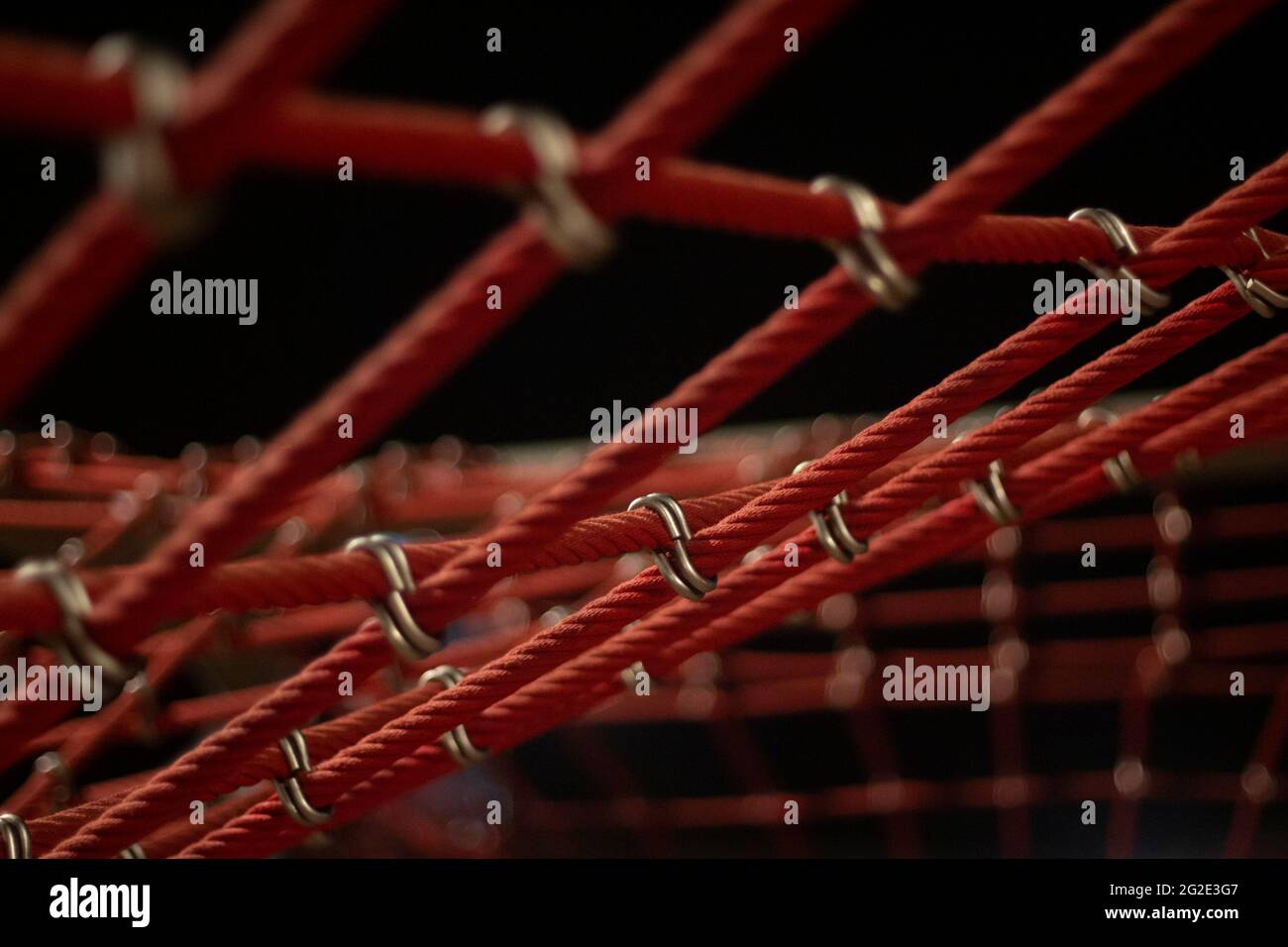 Ropes in the playground. Climbing net, shot close-up. Ropes fastened ...