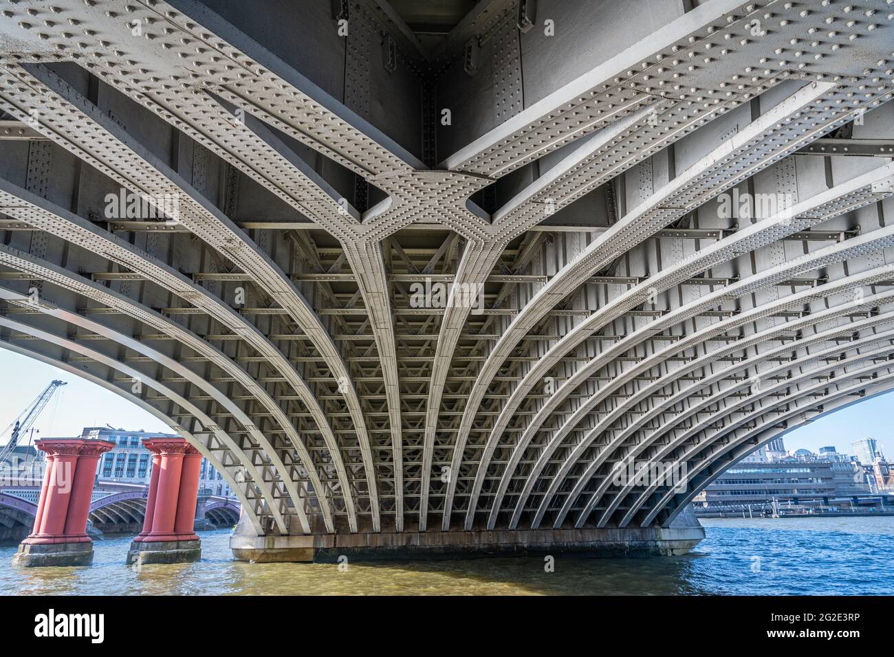 The underside of Blackfriars Railway Bridge over the River Thames with ...