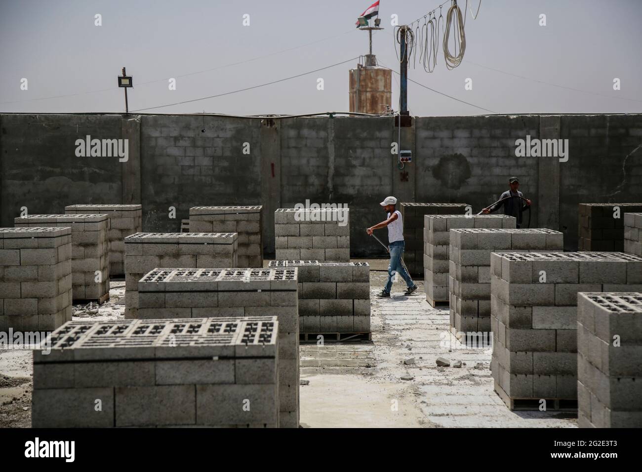 Gaza, Palestine. 10th June, 2021. Palestinian men working in a factory ...