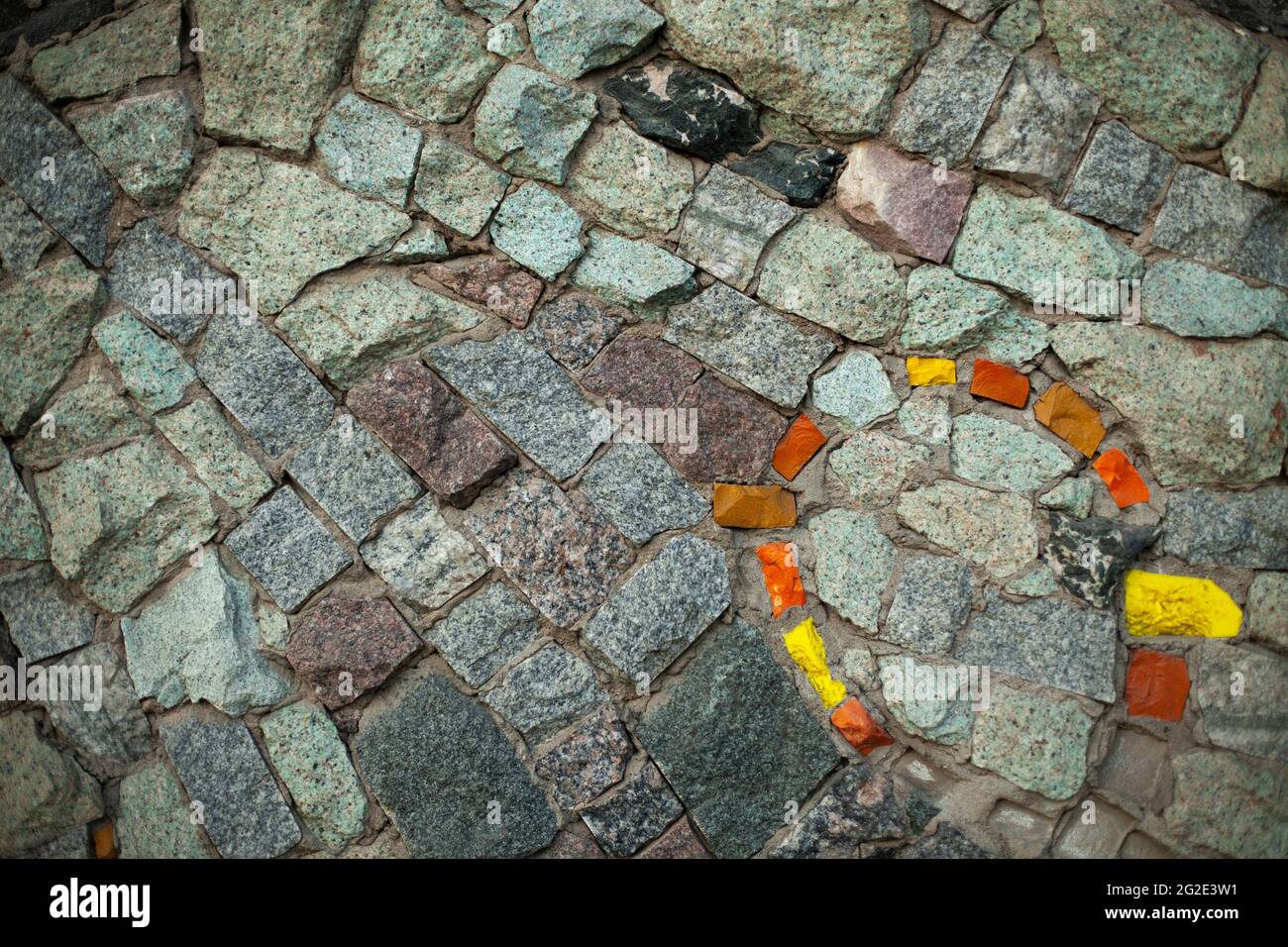 Details of the stone mosaic. Mosaic picture of pieces of stone. An ...